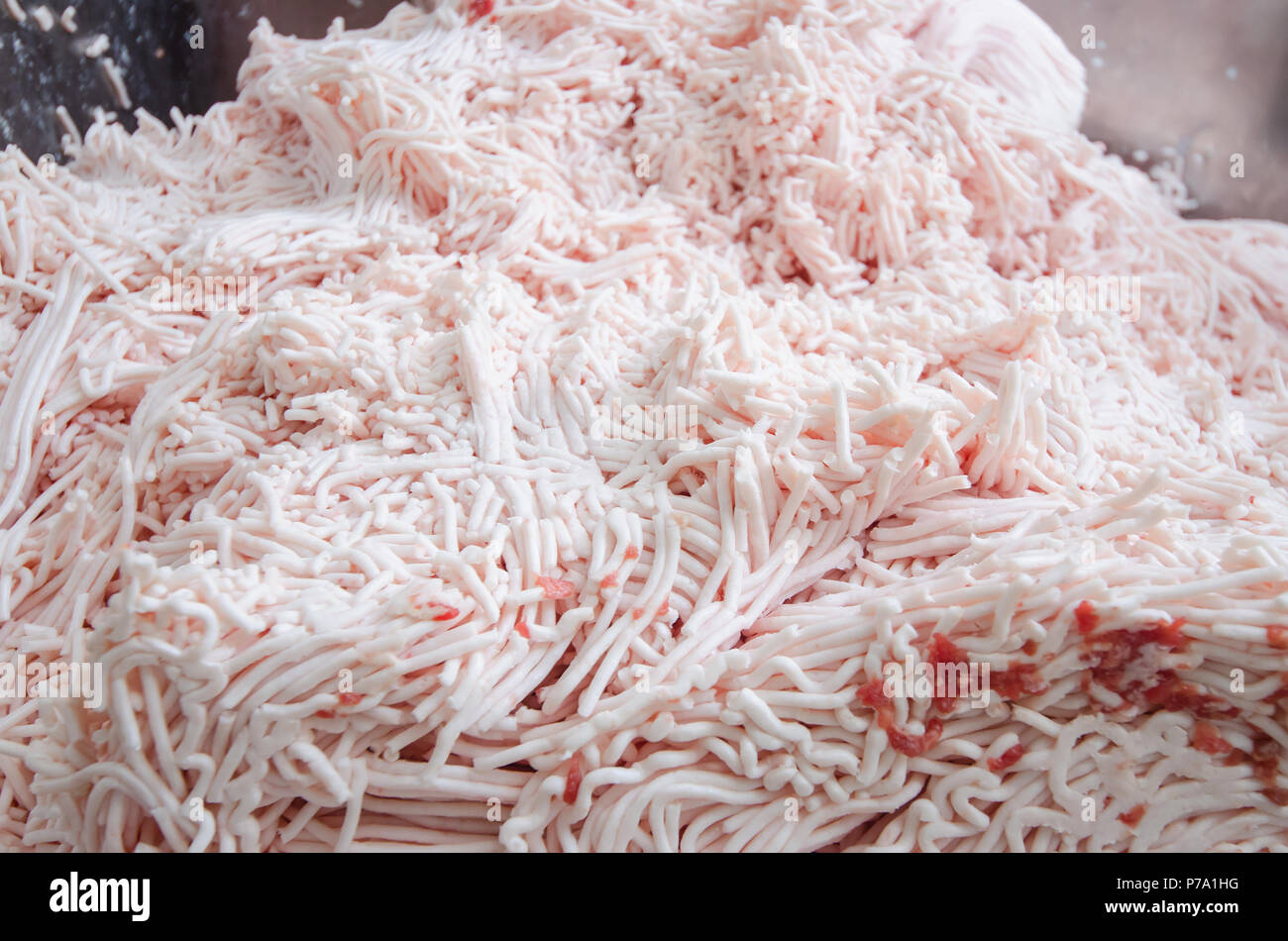 Meat grinder. Sausage production line. Process of sausage manufacturing ...