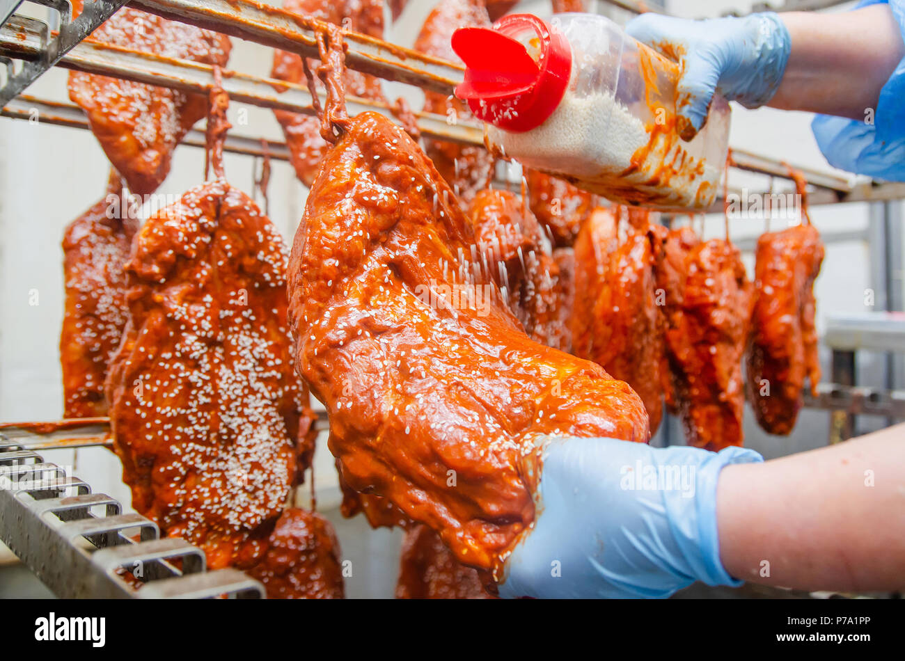 Pork. The line for the production of smoked delicacies. Industrial ...