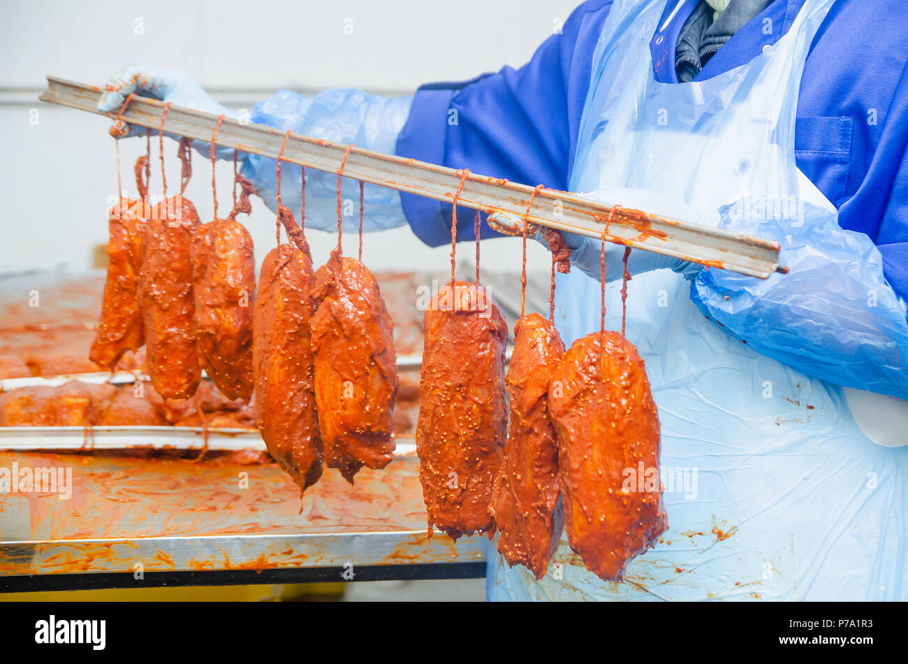 Pork. The line for the production of smoked delicacies. Industrial ...