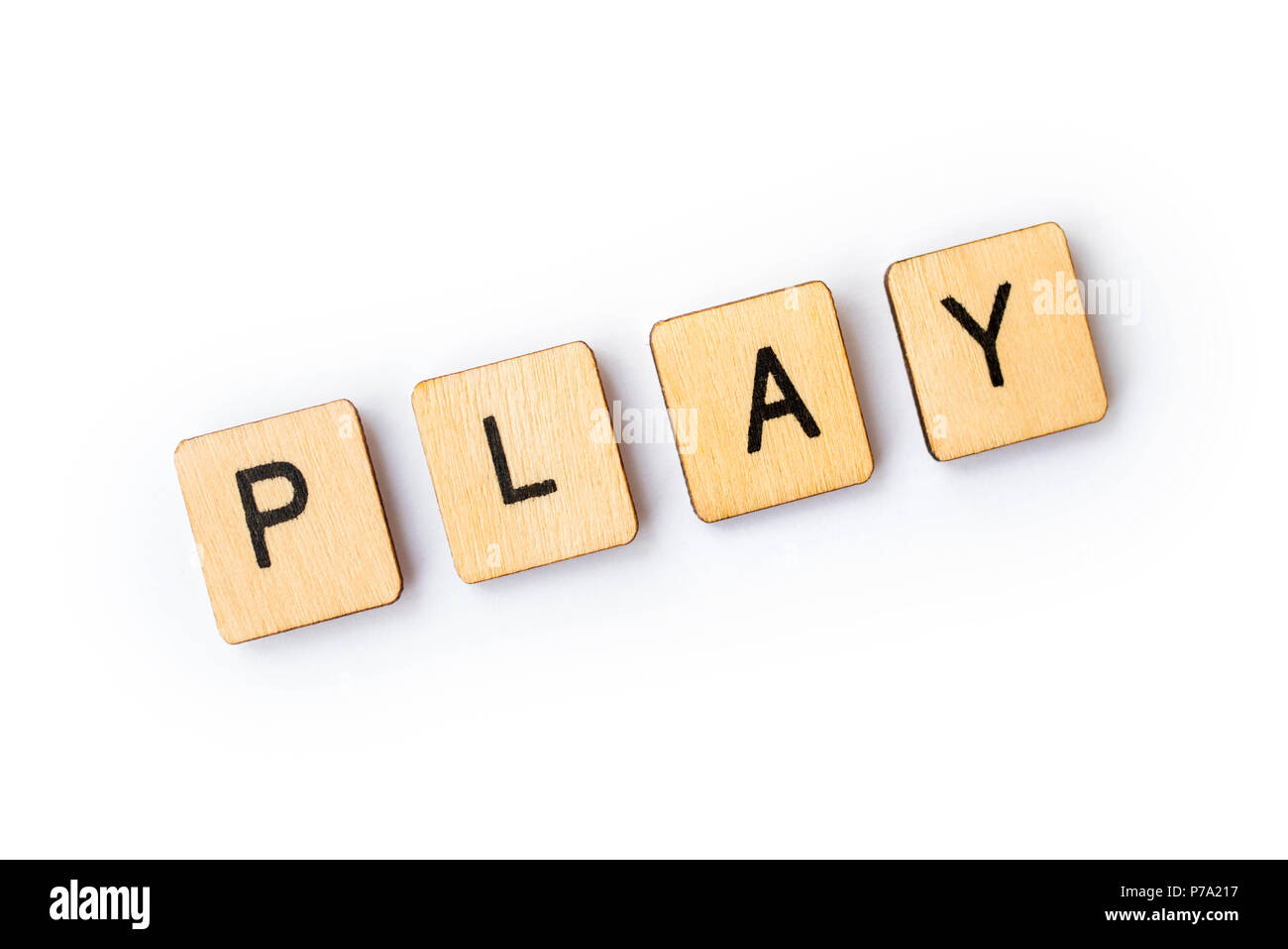 The word PLAY spelt out with wooden lettered tiles Stock Photo - Alamy