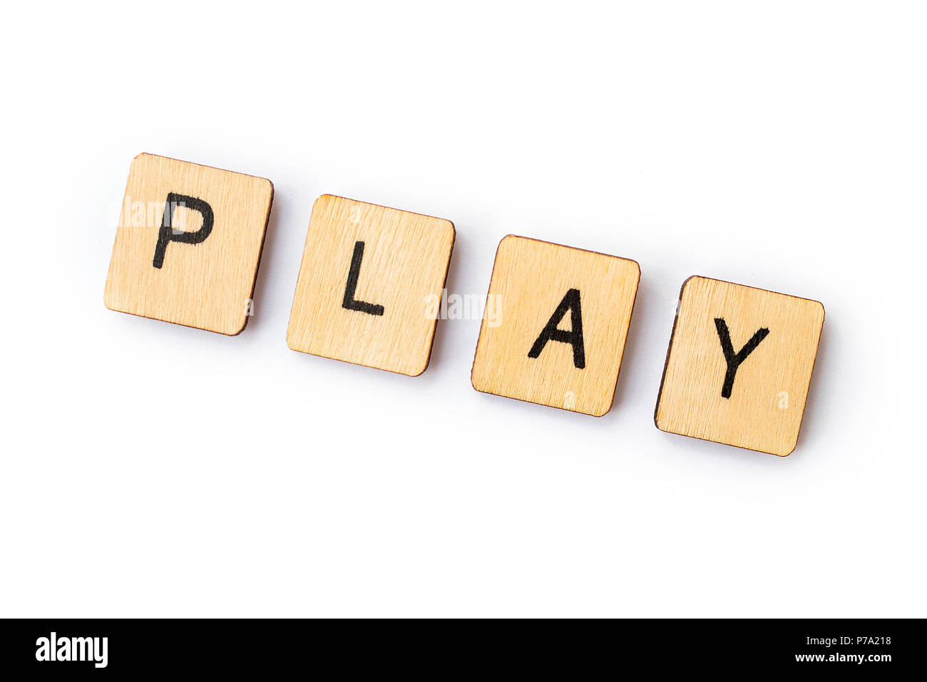 The word PLAY spelt out with wooden lettered tiles Stock Photo - Alamy