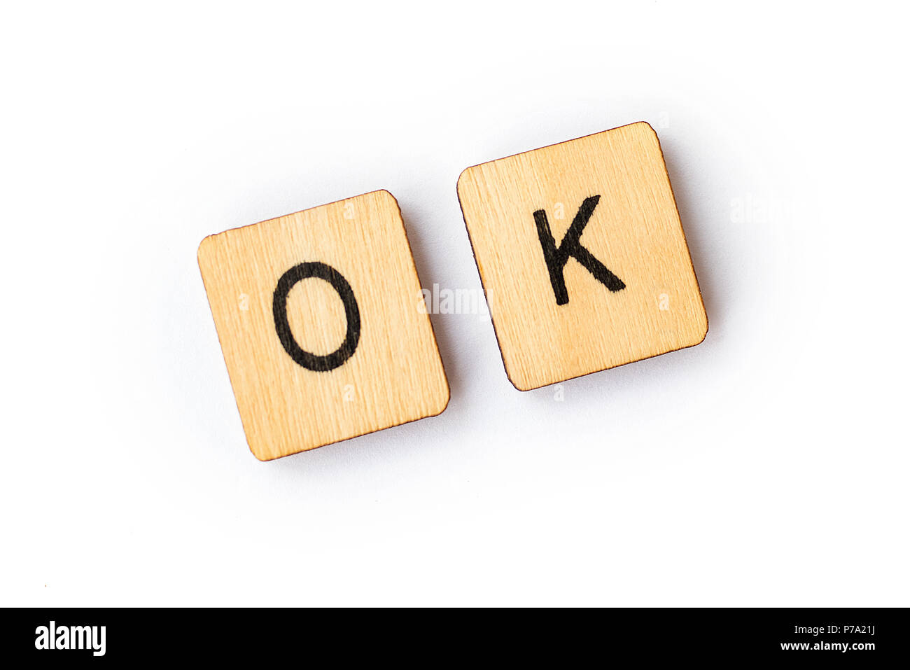 The word OK spelt out with wooden lettered tiles Stock Photo - Alamy