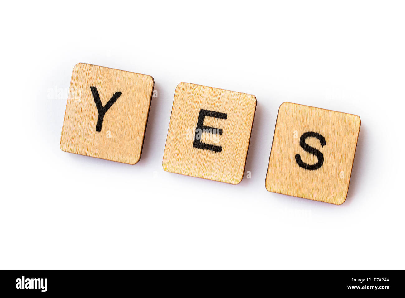The word YES, spelt with wooden letter tiles Stock Photo - Alamy