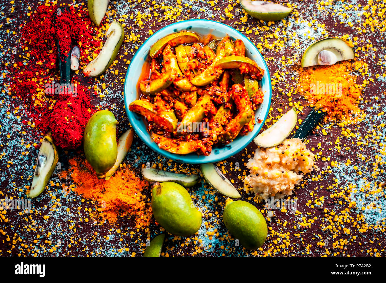 Close up of Aam ka achar or kari ka achar with all its ingredients and ...