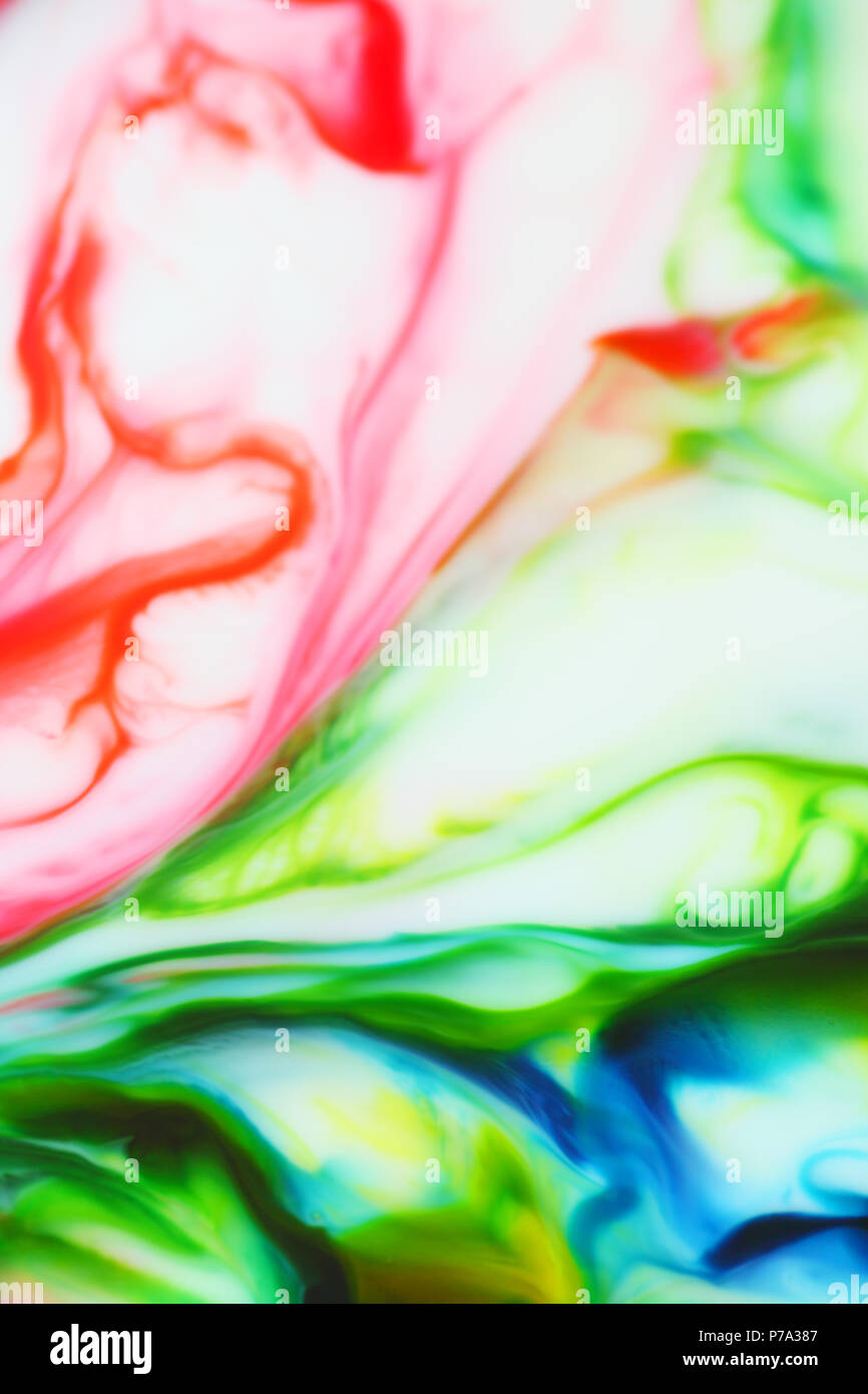 Paints in red, green, yellow and blue on a white background Stock Photo ...