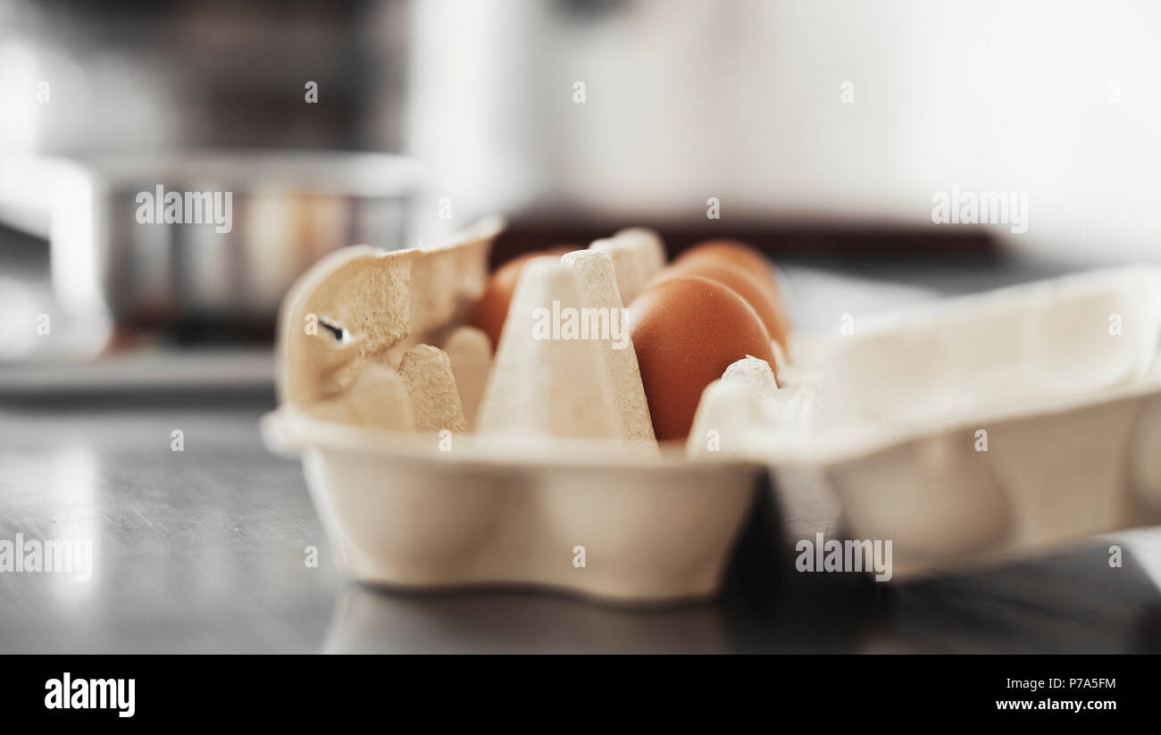 Egg carton box on metal table Stock Photo - Alamy