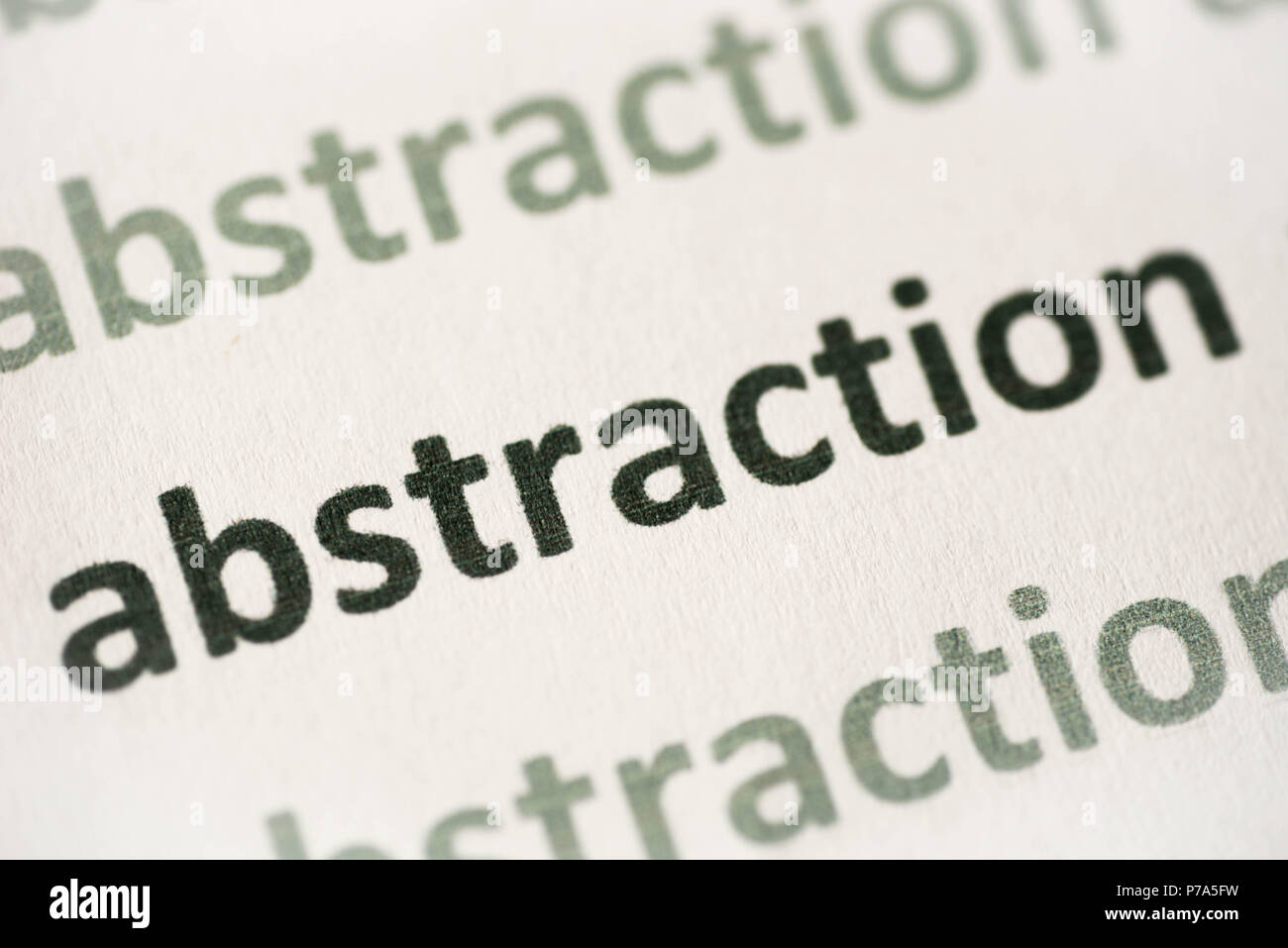 word abstraction printed on white paper macro Stock Photo - Alamy