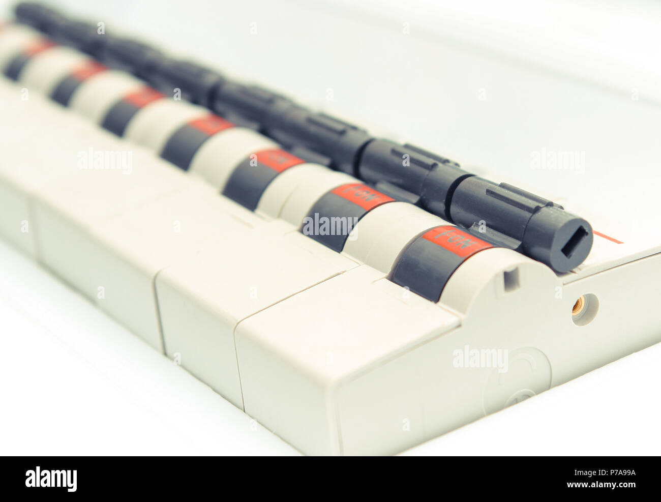 Closeup of electric switch on white control panel, engineering and ...