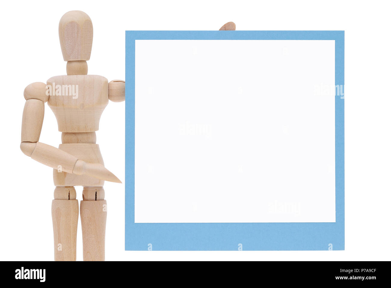 Wooden dummy with blank instant photo isolated on white background ...