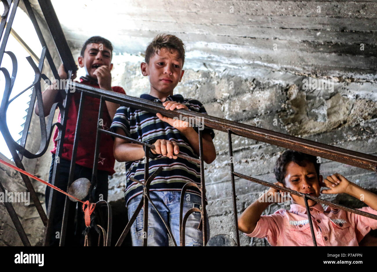3 Palestinian children cry during the farewell of the martyr in his ...