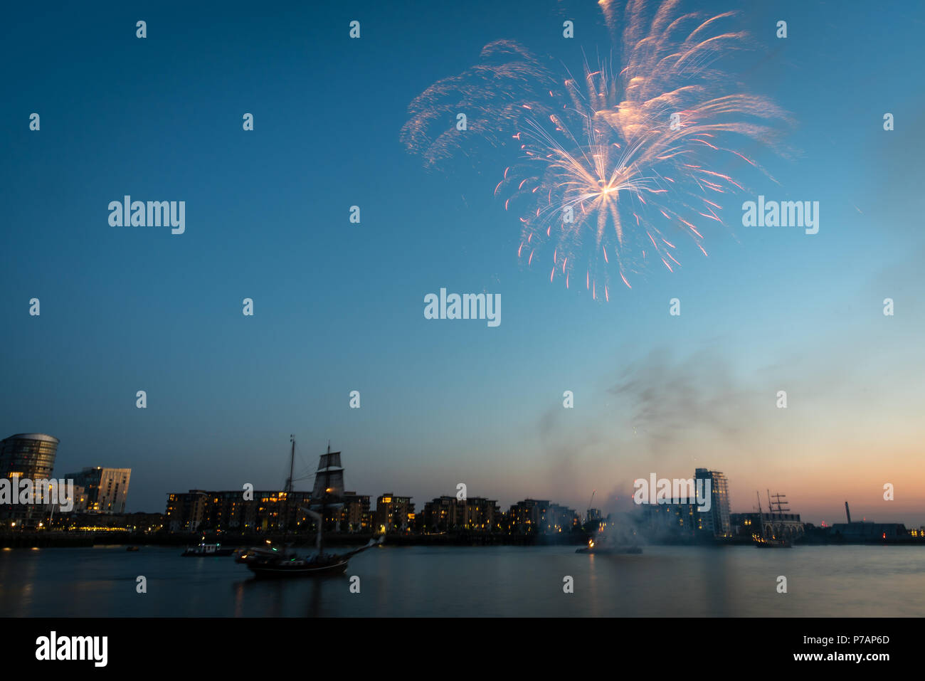 Tall ships sail up the River Thames, culminating in a fireworks display ...