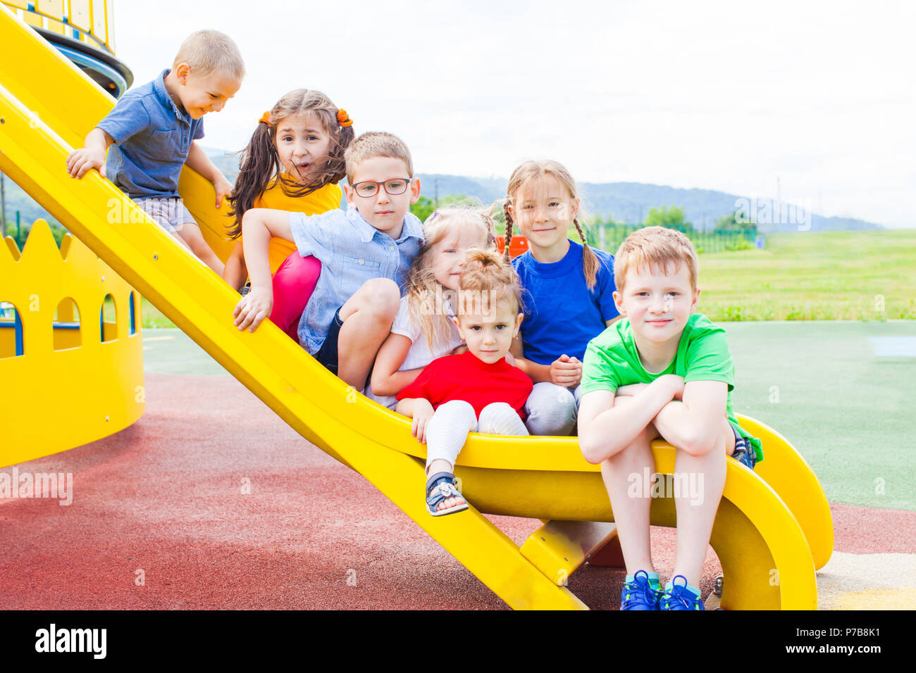 Children have fun on the slide Stock Photo - Alamy