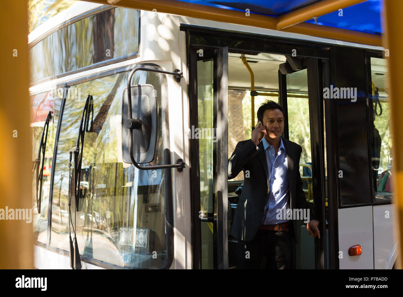 Man getting out from the bus Stock Photo - Alamy