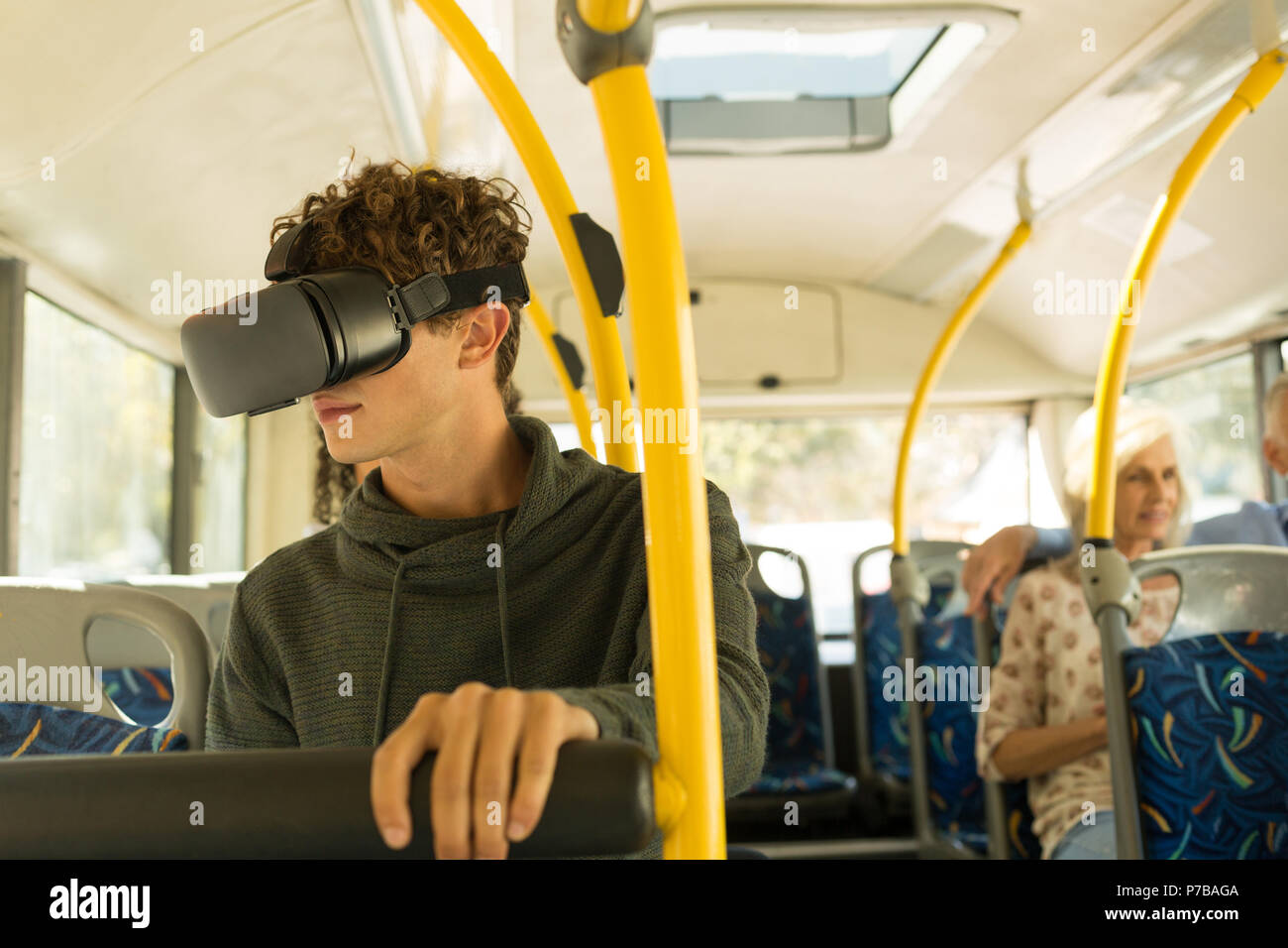 Young curly man using hi-res stock photography and images - Alamy