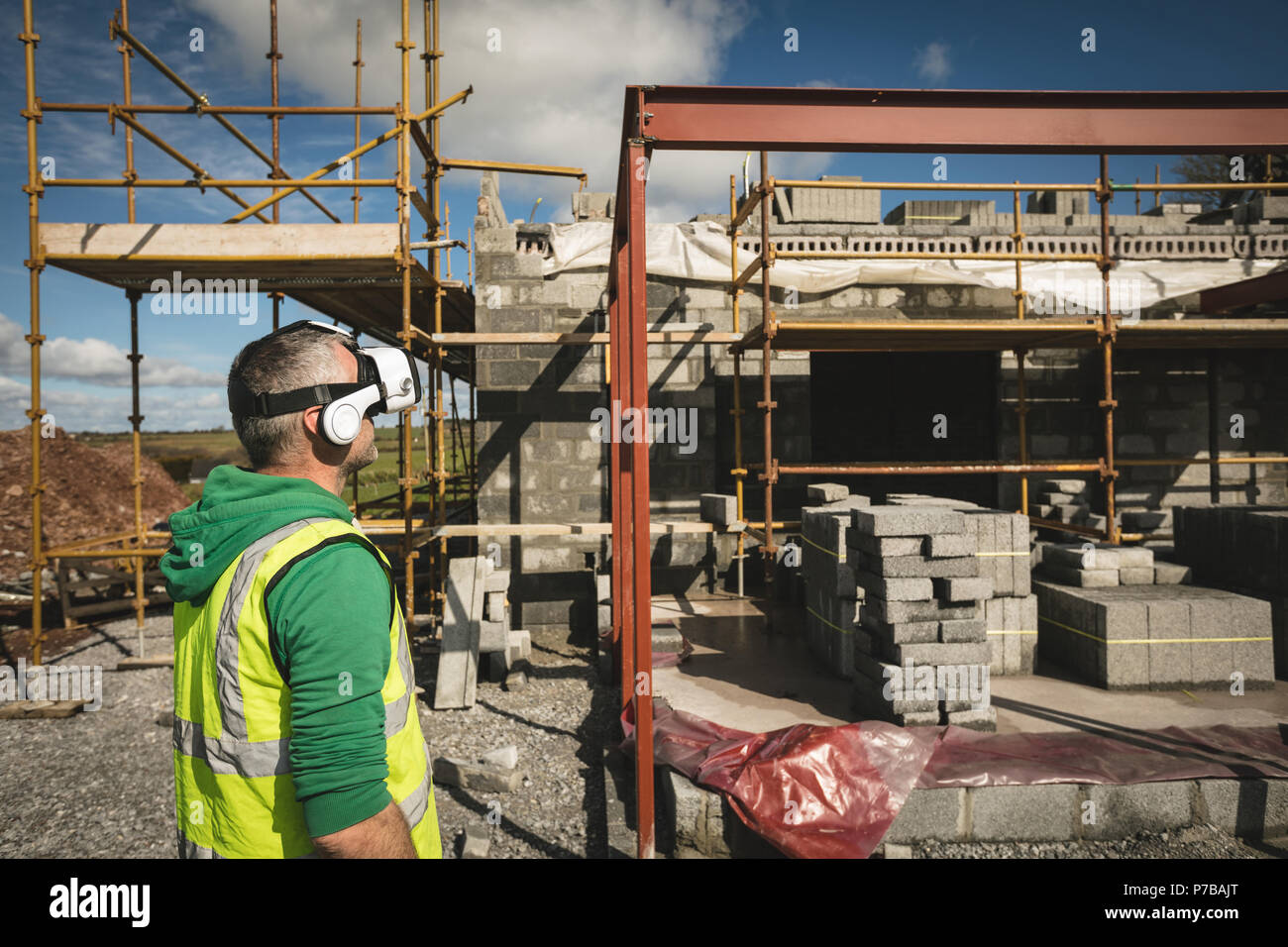 Engineer with VR headset looking at the construction site Stock Photo ...