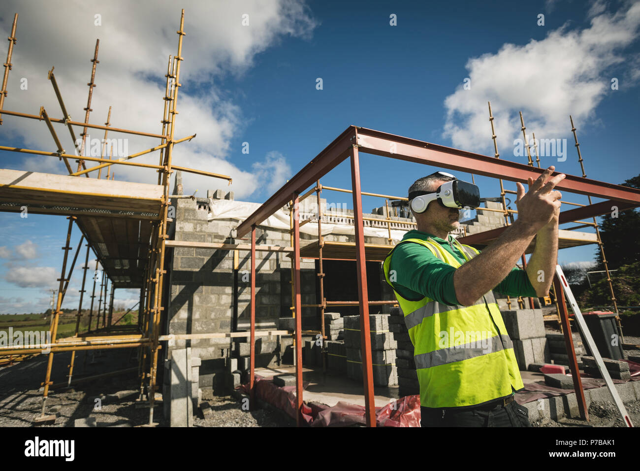 Engineer experiencing VR headset at the construction site Stock Photo ...
