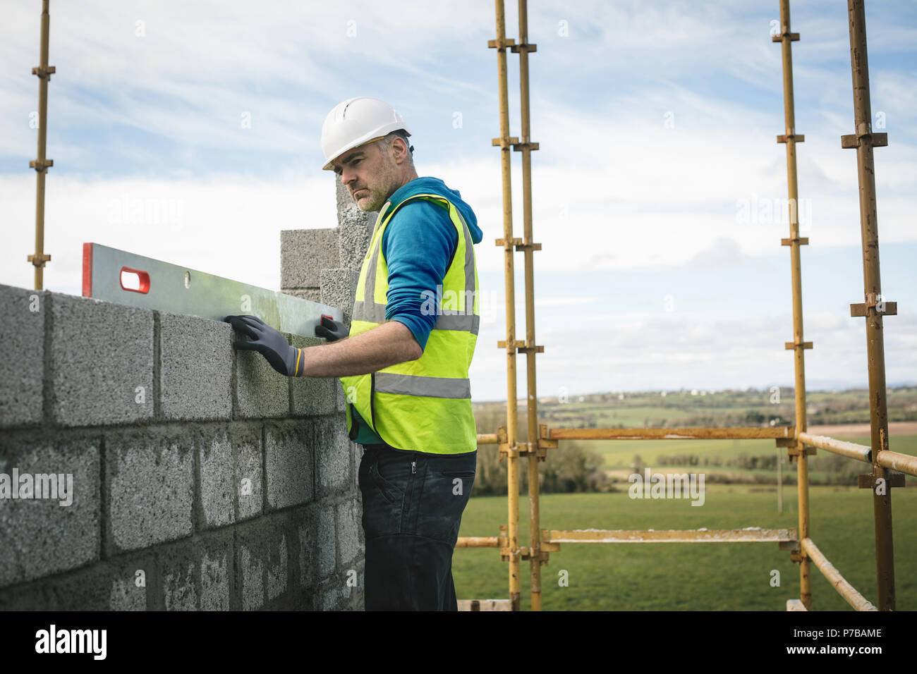 Engineer doing a level check on the wall Stock Photo - Alamy