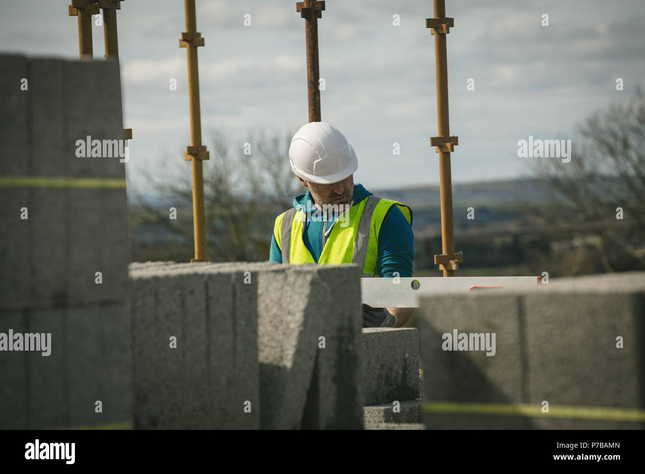 Engineer doing at level check on the wall Stock Photo - Alamy