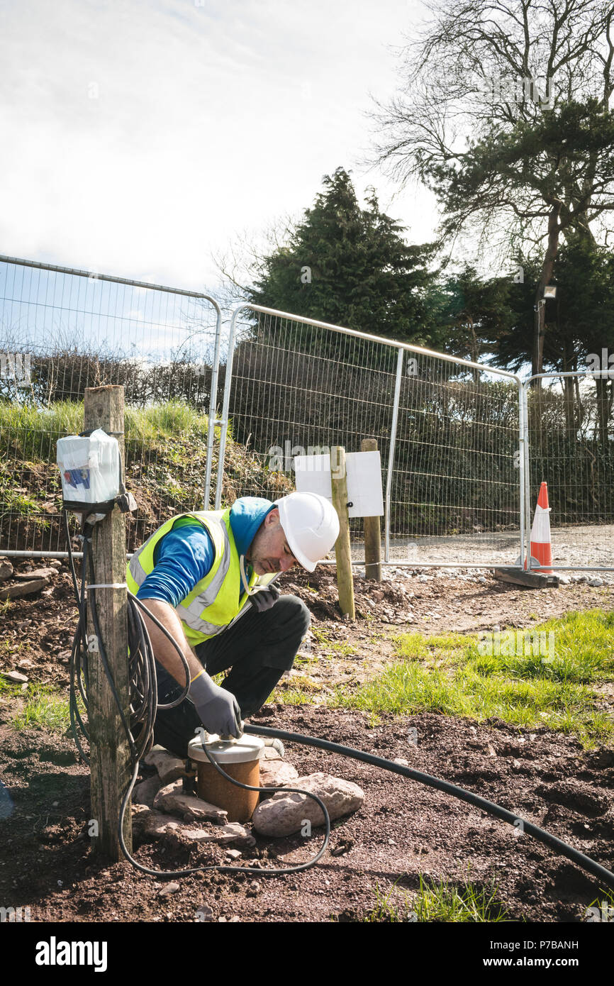 Builder installing a water pump Stock Photo - Alamy