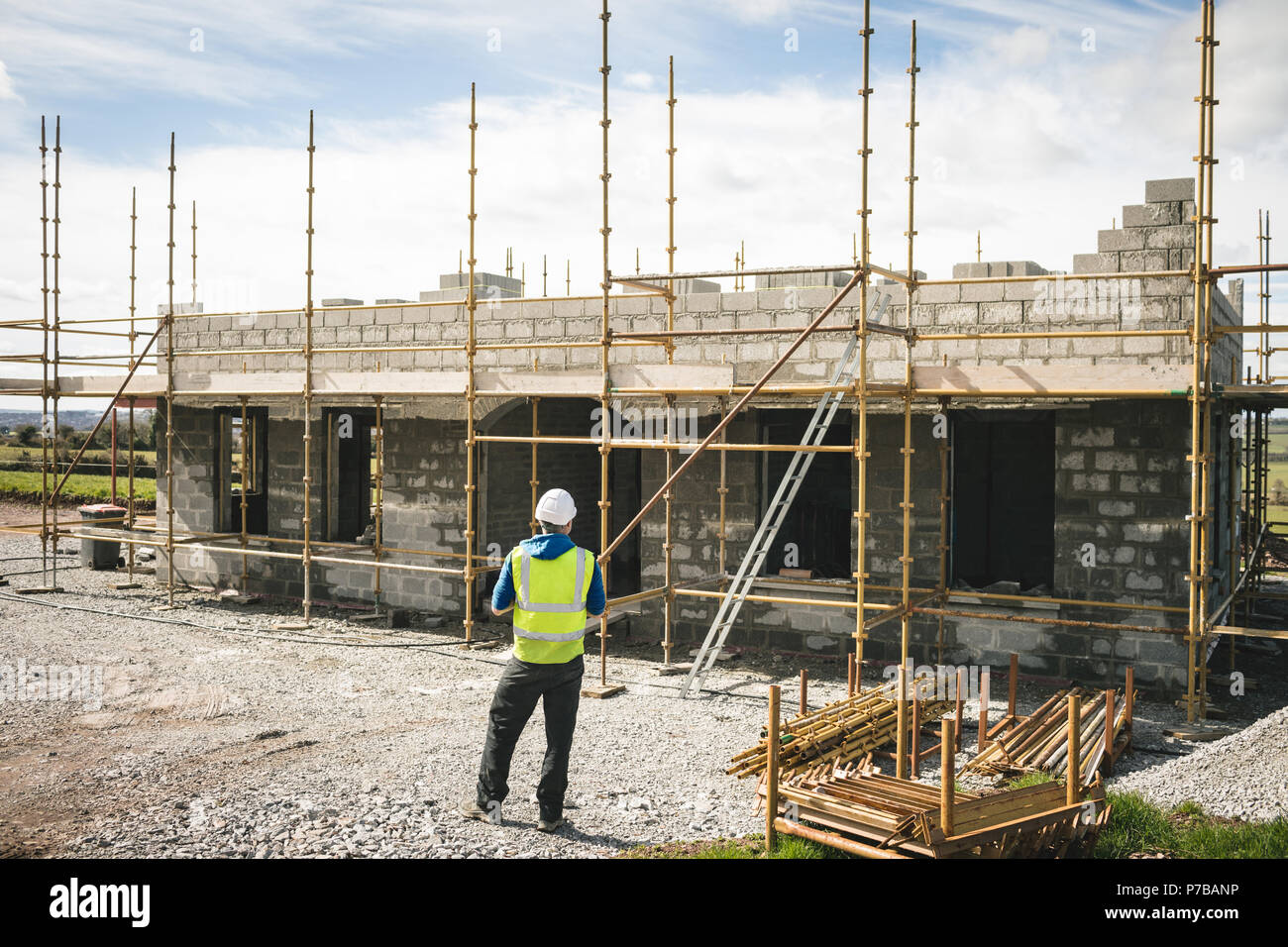 Engineer looking at the construction site Stock Photo - Alamy