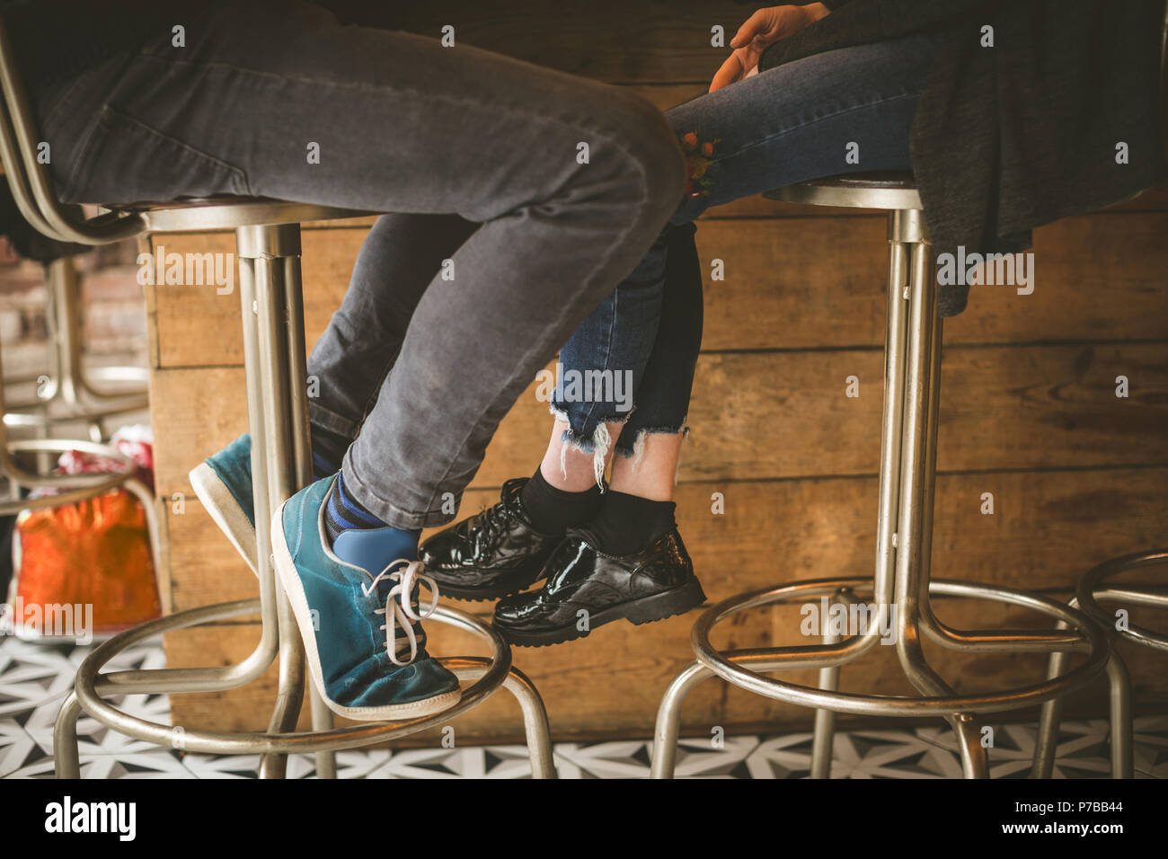 Legs woman sitting bar counter hi-res stock photography and images - Alamy