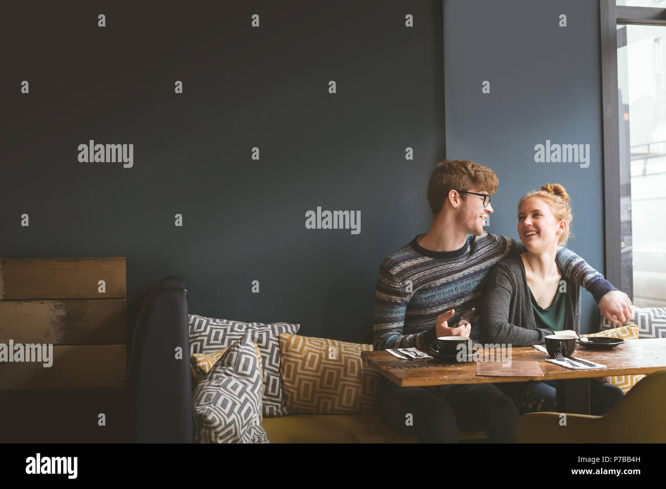 Modern young couple talking in hi-res stock photography and images - Alamy