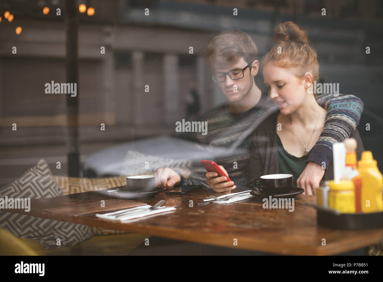 Mobile hugging hi-res stock photography and images - Alamy