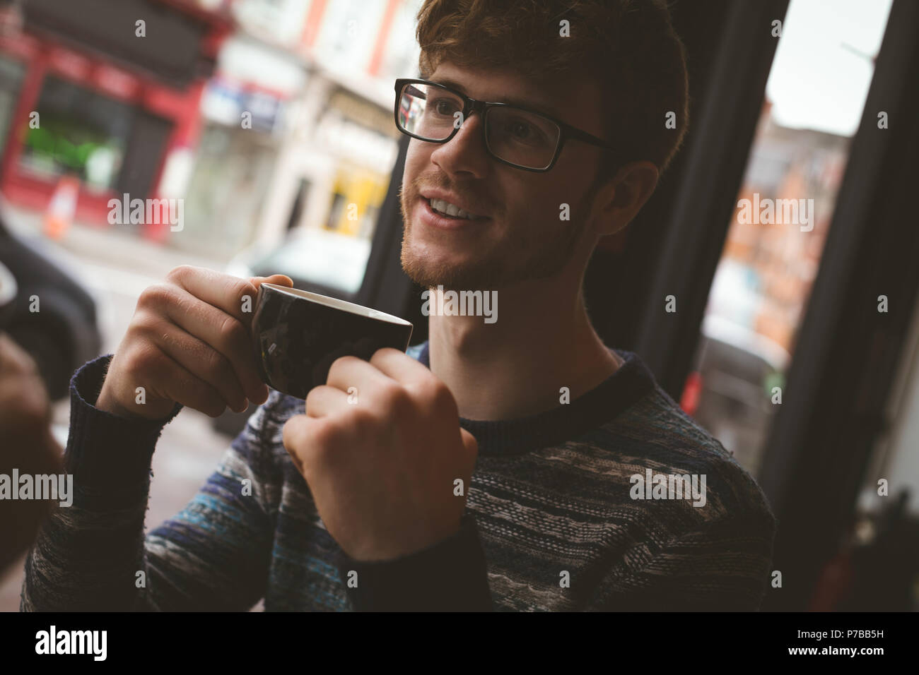 Man having coffee in cafe Stock Photo - Alamy