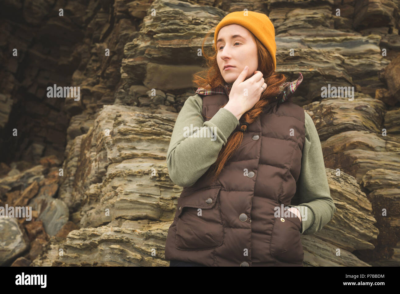 Girl leaning against rock hi-res stock photography and images - Alamy