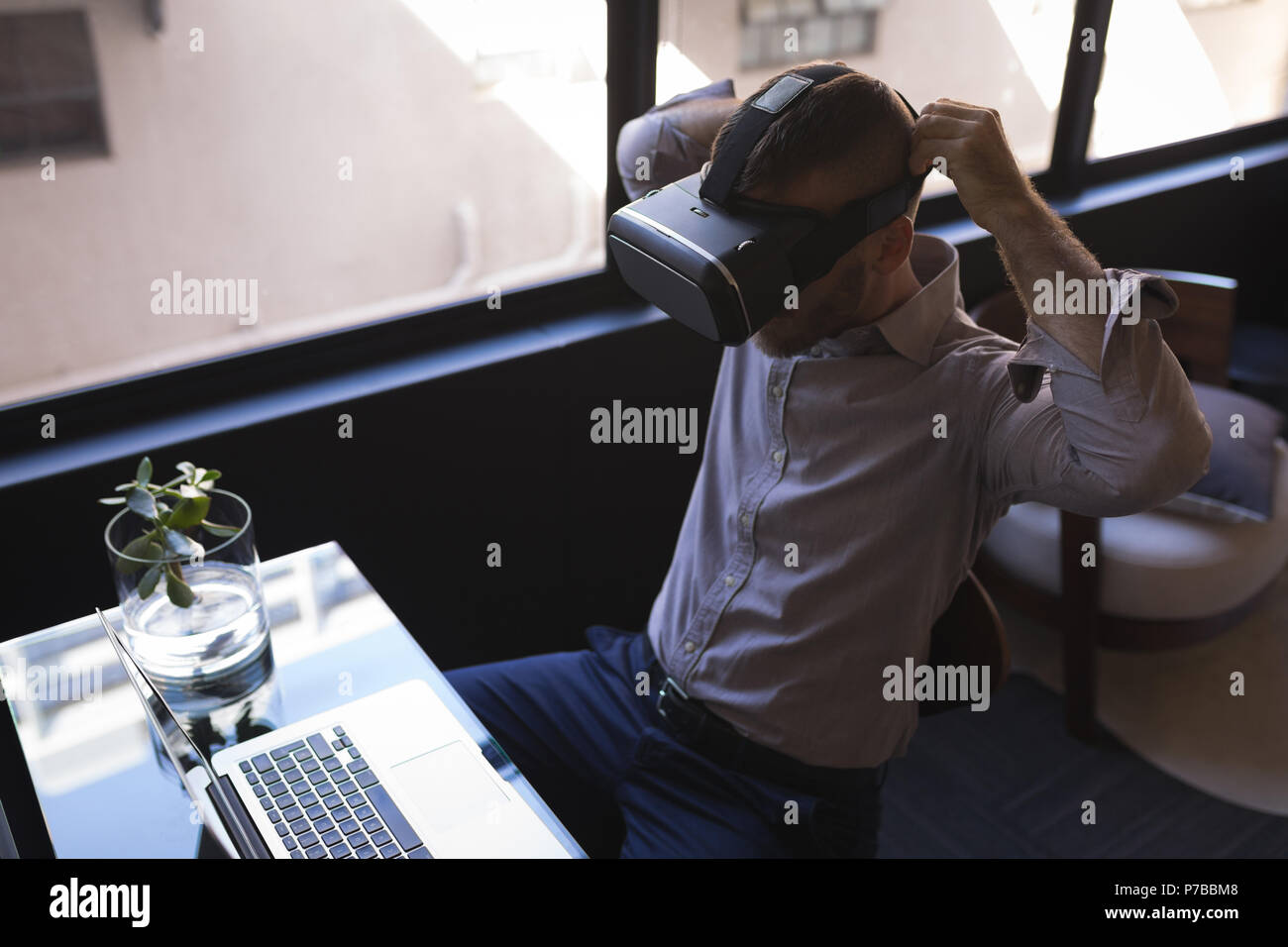 Businessman using headset while working hi-res stock photography and ...