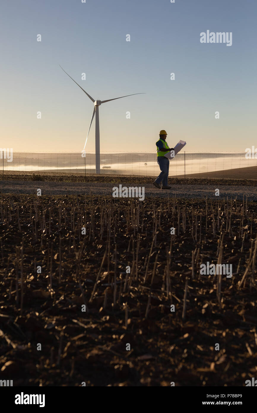 Engineer holding a layout plot Stock Photo - Alamy