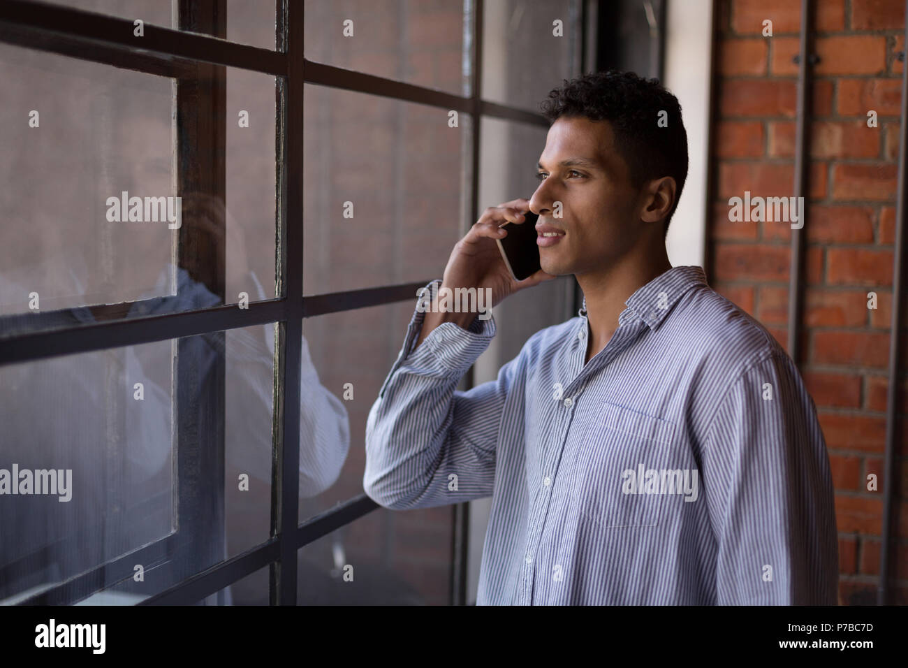 Young handsome hipster man talking hi-res stock photography and images ...