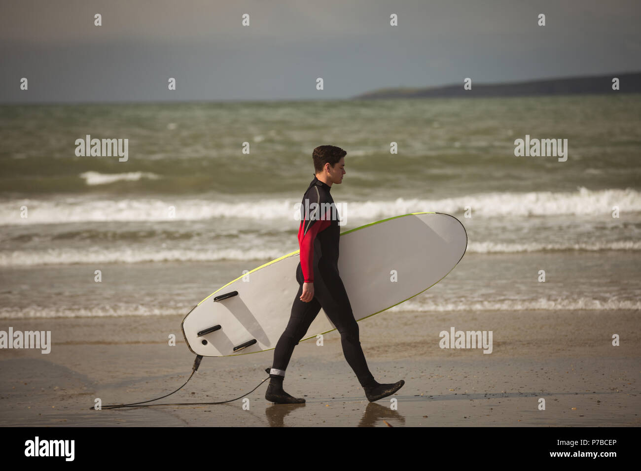 Walking surfer on beach hi-res stock photography and images - Alamy