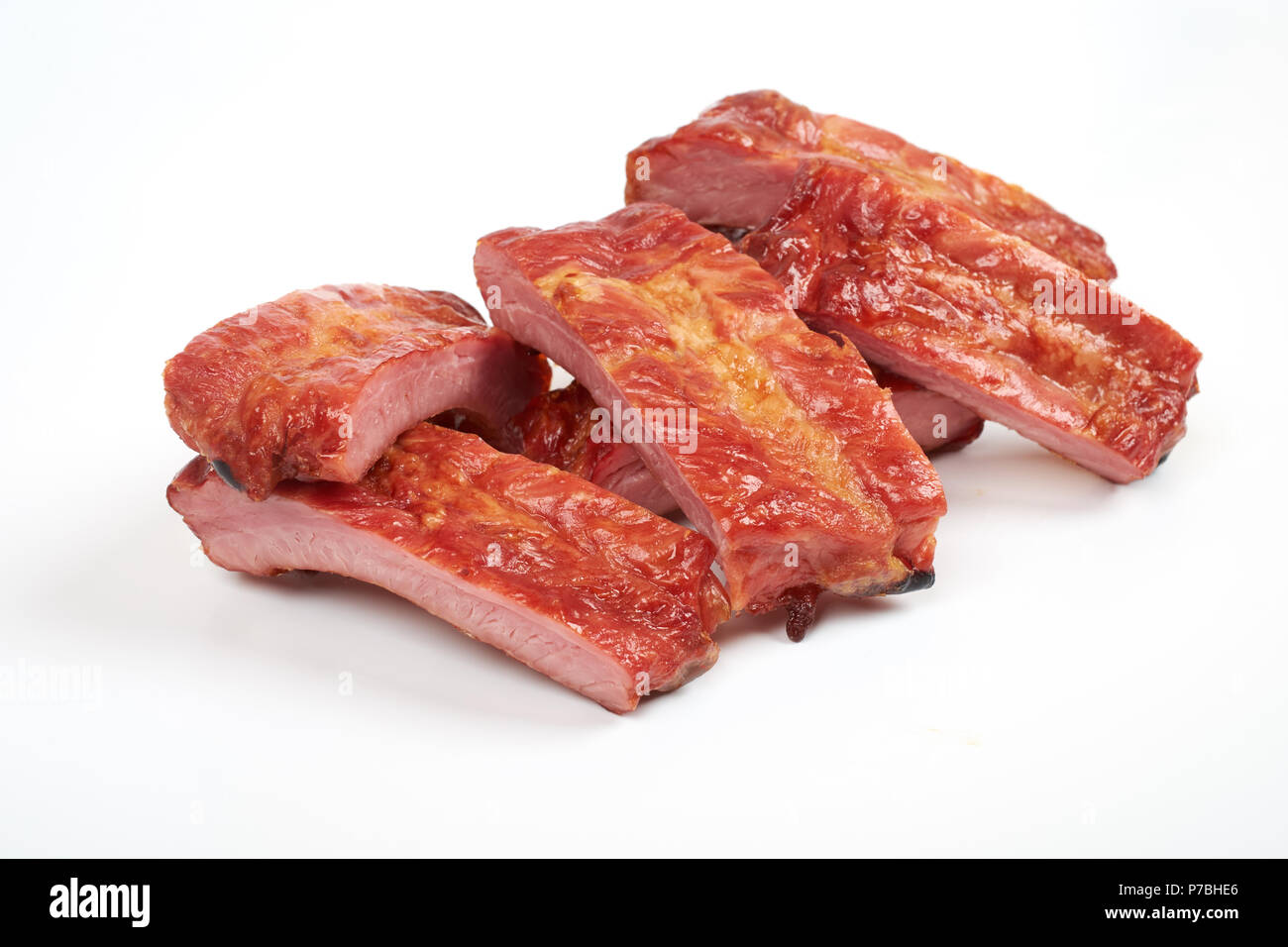 Grilled pork ribs isolated on white background Stock Photo - Alamy