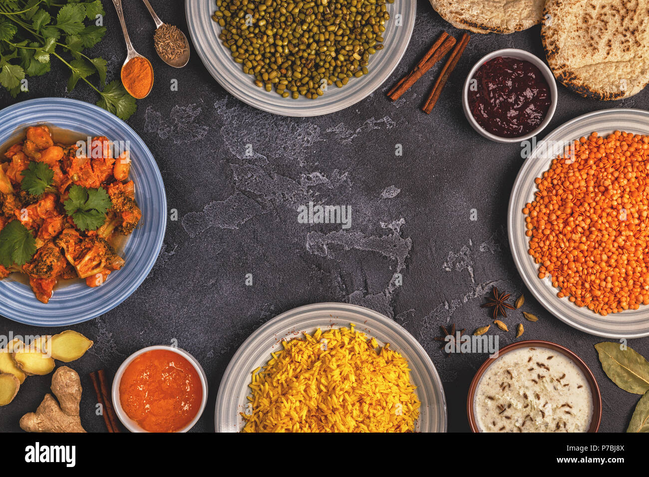 Traditional Indian curry with rice, lentils and mung beans. Top view ...
