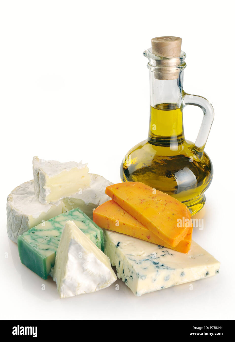 collection of cheeses and olive oil on awhite background Stock Photo ...