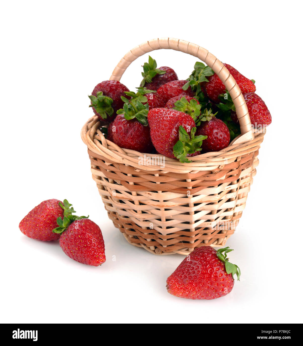 strawberries in a basket on a white background Stock Photo - Alamy