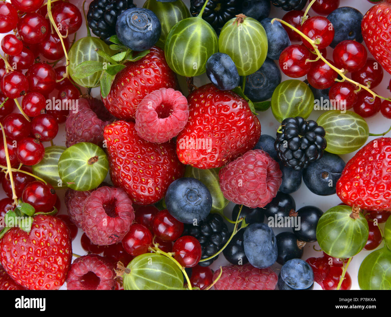 different fresh berries as background Stock Photo - Alamy