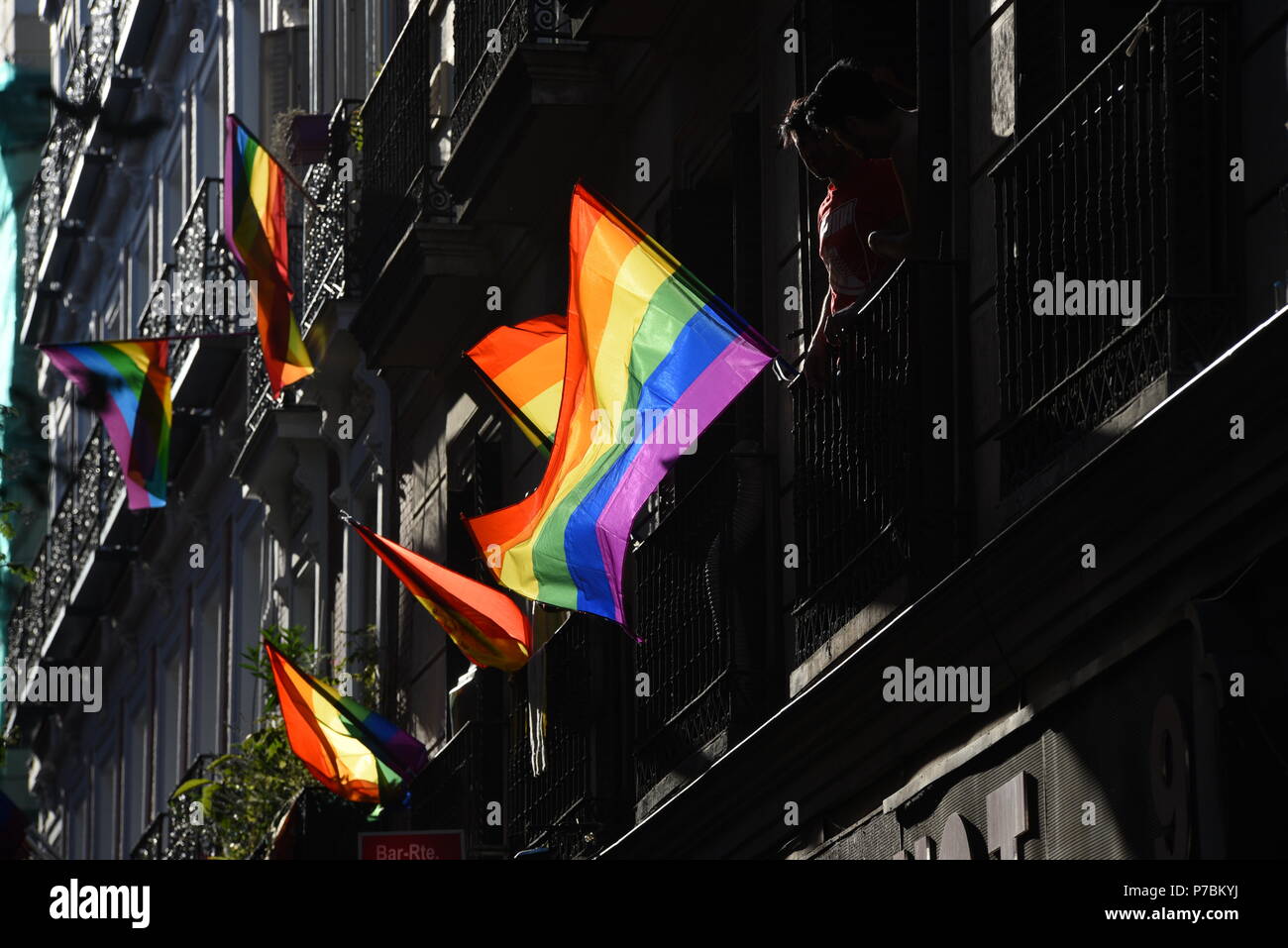 Gay Pride rainbow coloured flags decorate balconies of a building in ...
