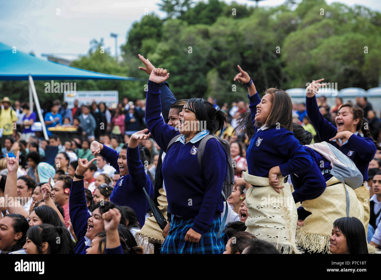 Teenage girls in crowd dancing at the annual Polyfest festival in ...