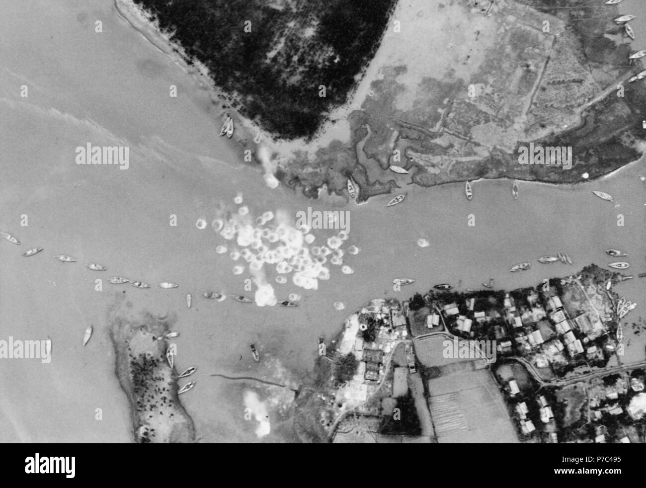 20 mm shells from a A-4E Skyhawk of VA-55 hit barges in Vietnam on 20 ...