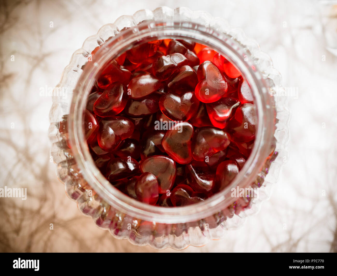 Gummy candy with red heart shapes in a glass Stock Photo - Alamy