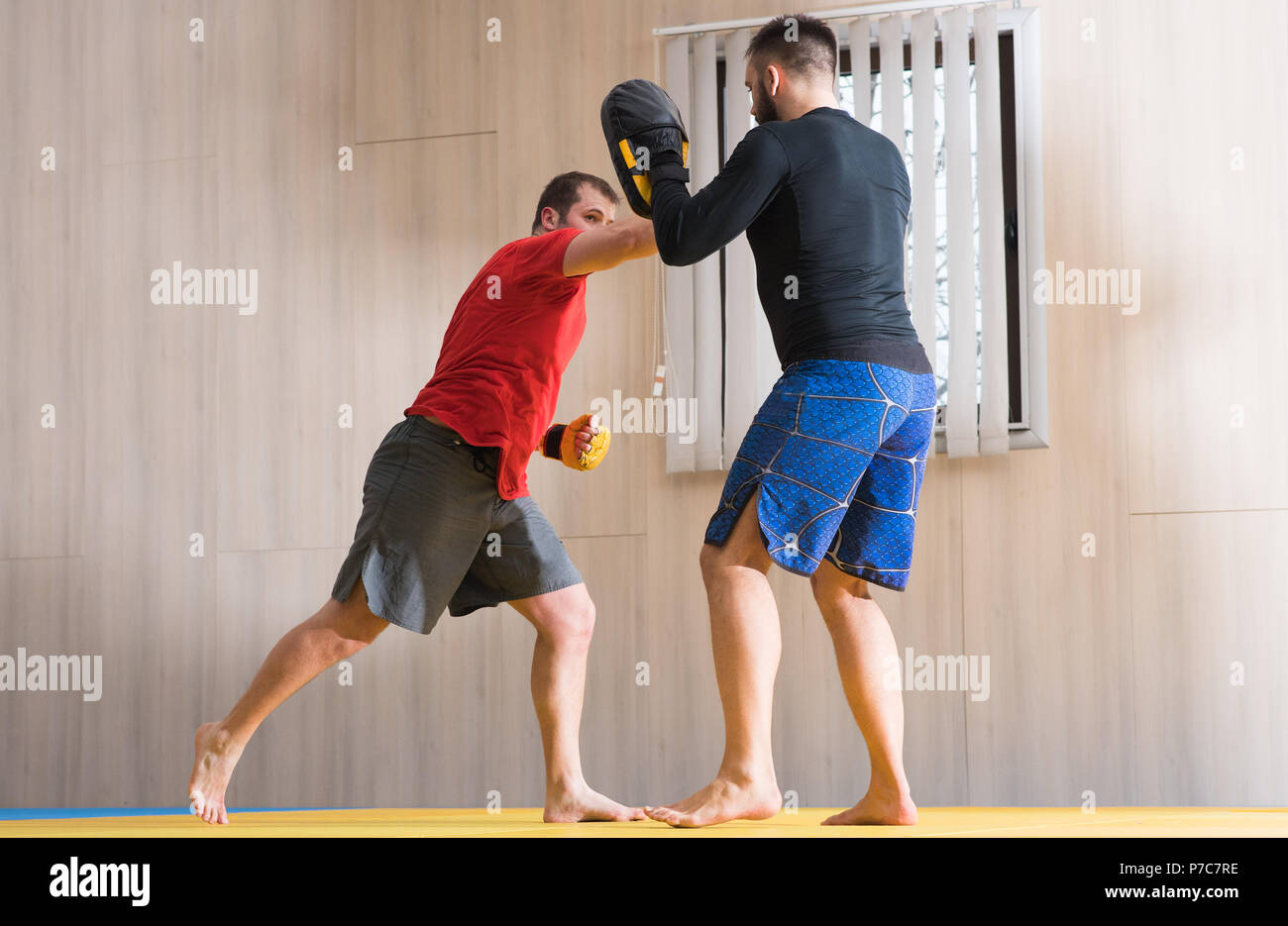 Young Fighters training his MMA skills Stock Photo - Alamy