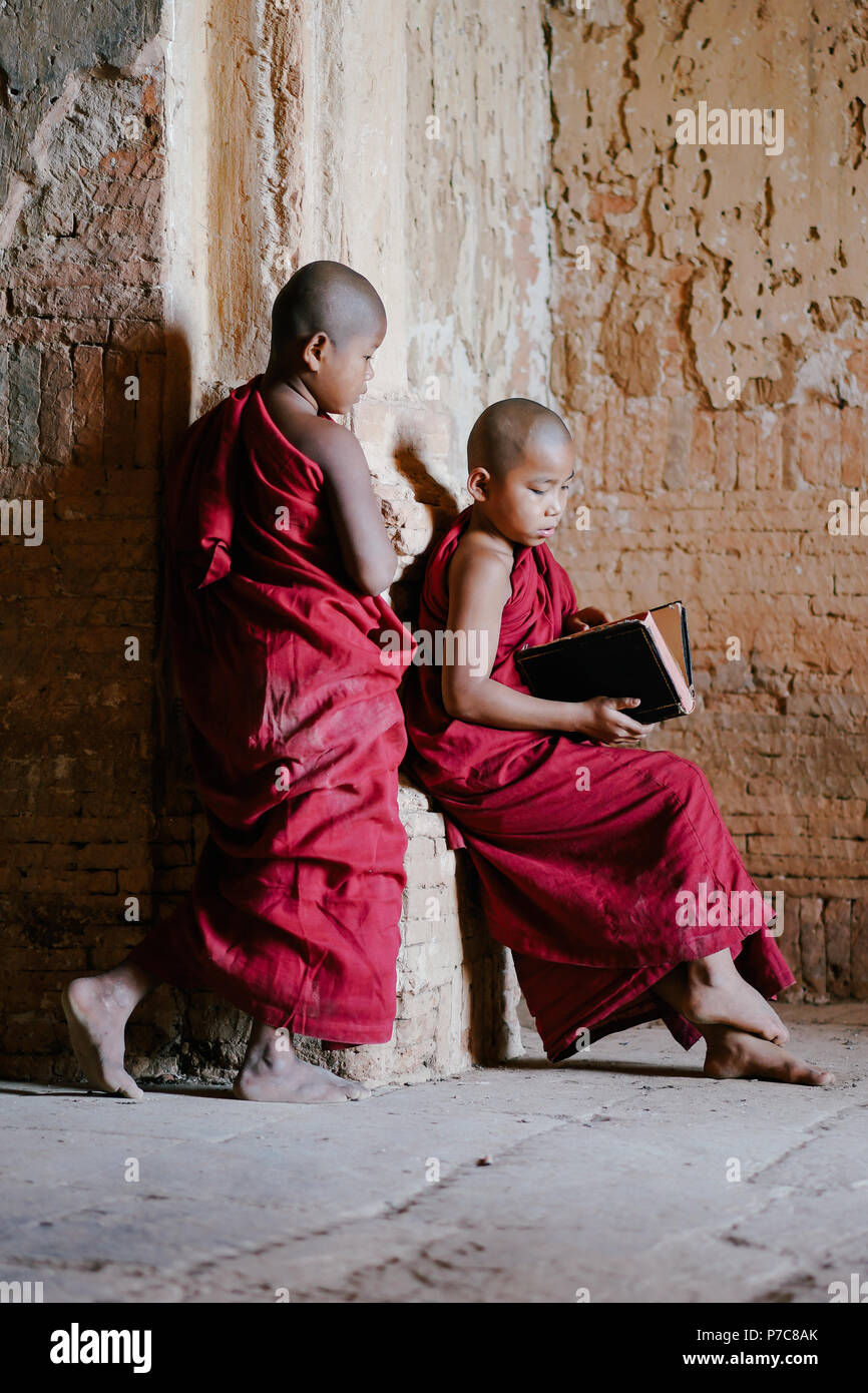 Two little monks in a ruin pagoda in Bagan, Myanmar Stock Photo - Alamy