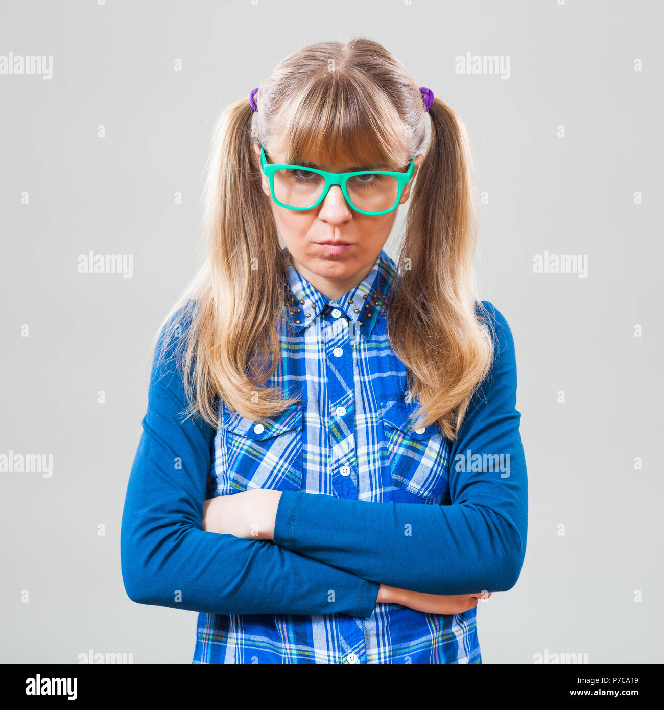 Studio shot portrait of angry nerdy woman Stock Photo - Alamy