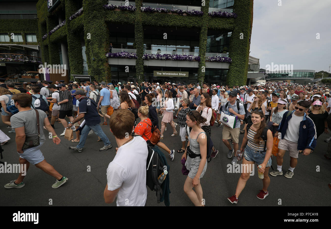 Spectators are led into the grounds on day four of the Wimbledon ...