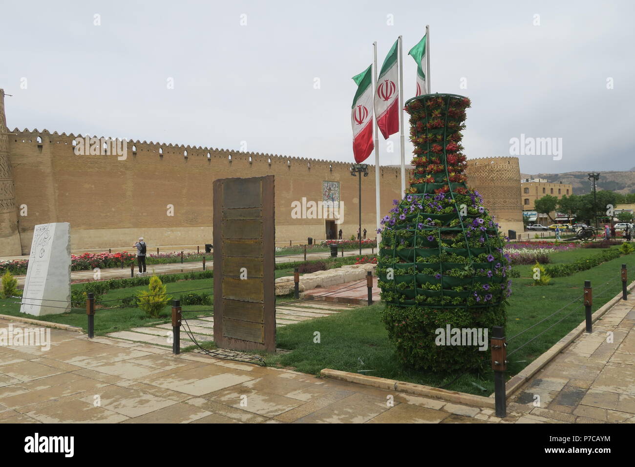 Huge vase of flowers, Arg Karim Khan castle on background, Shiraz, Iran ...