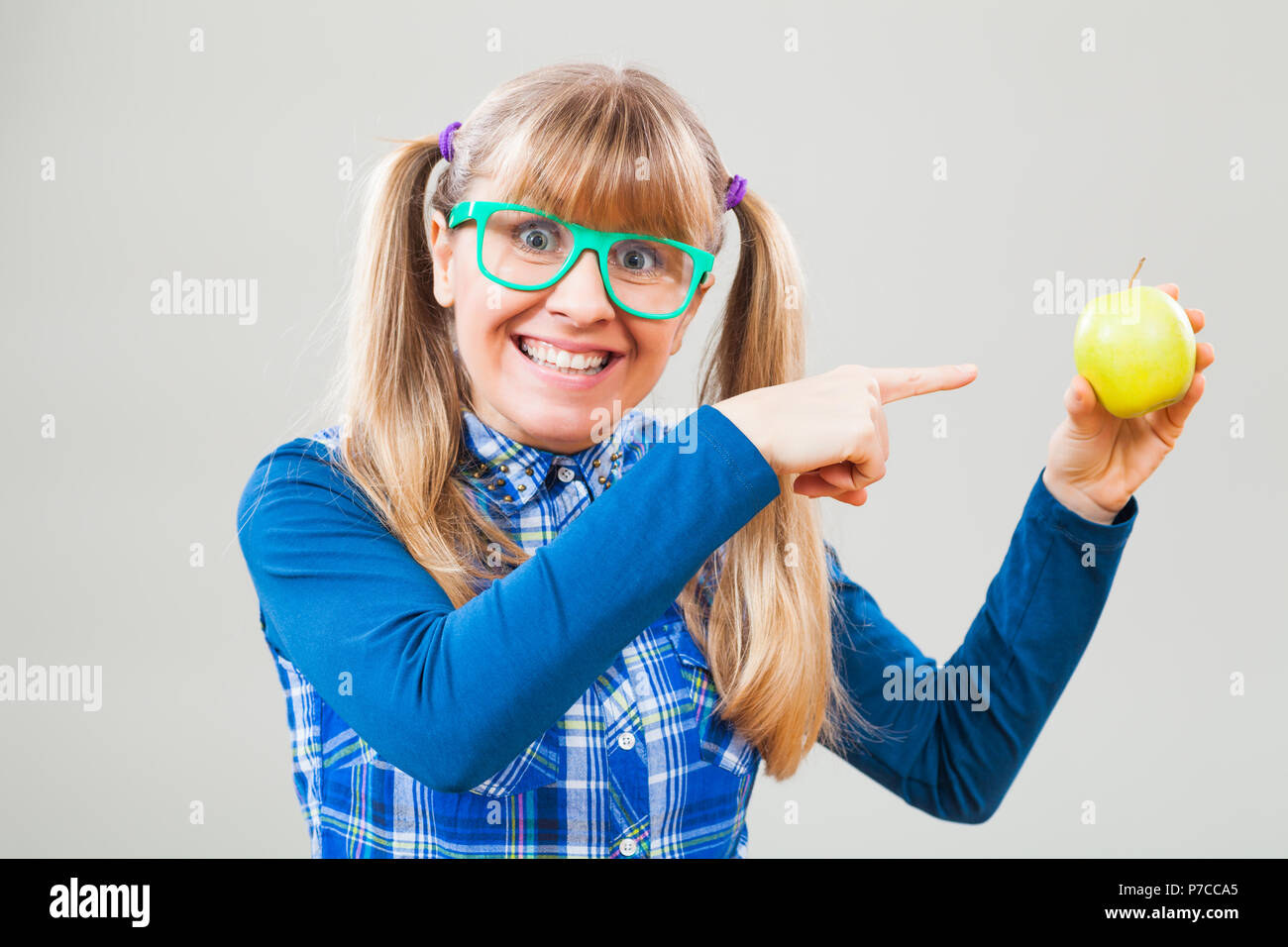 Healthy woman pointing apple hi-res stock photography and images - Alamy