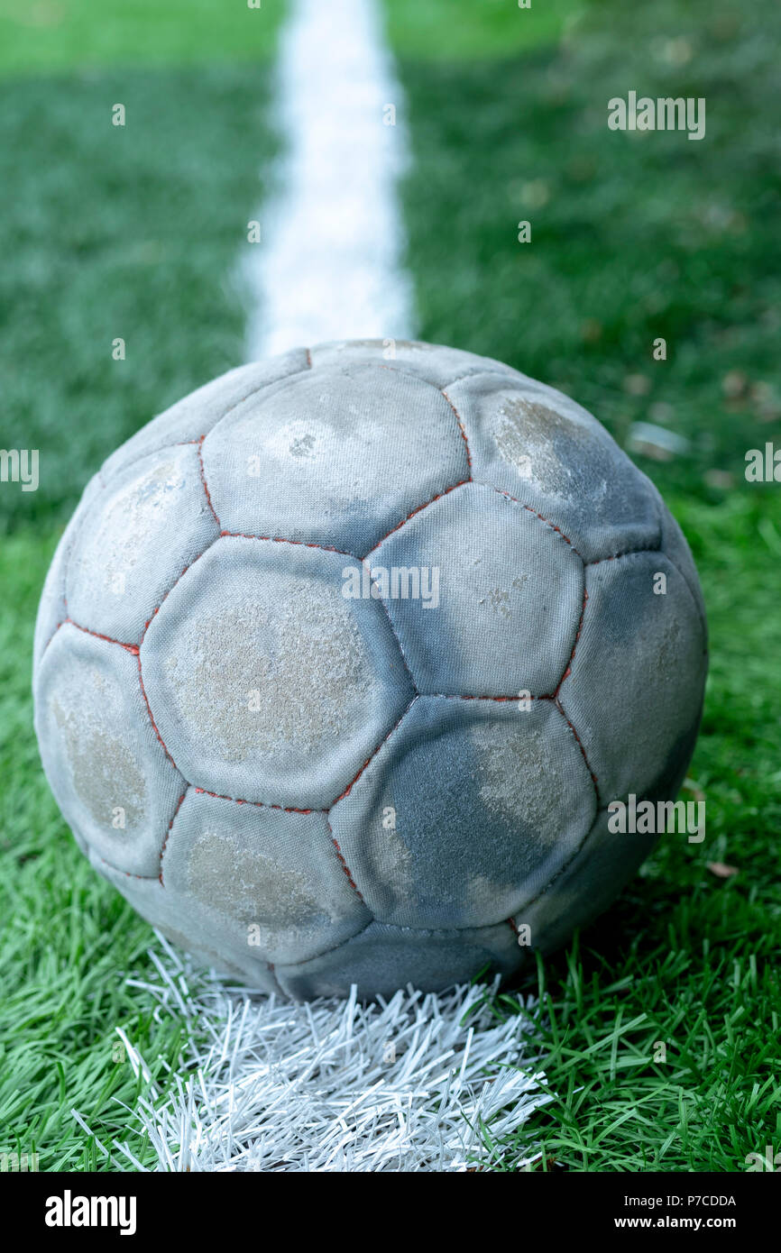 Old and used soccer ball is on field and ready to play with Stock Photo ...