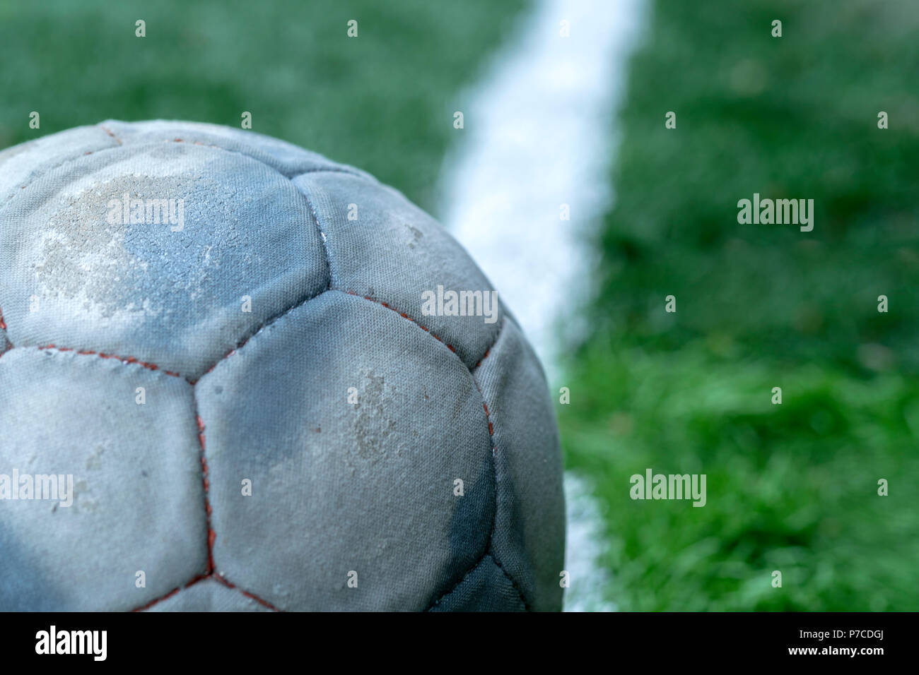 Old and used soccer ball is on field and ready to play with Stock Photo ...